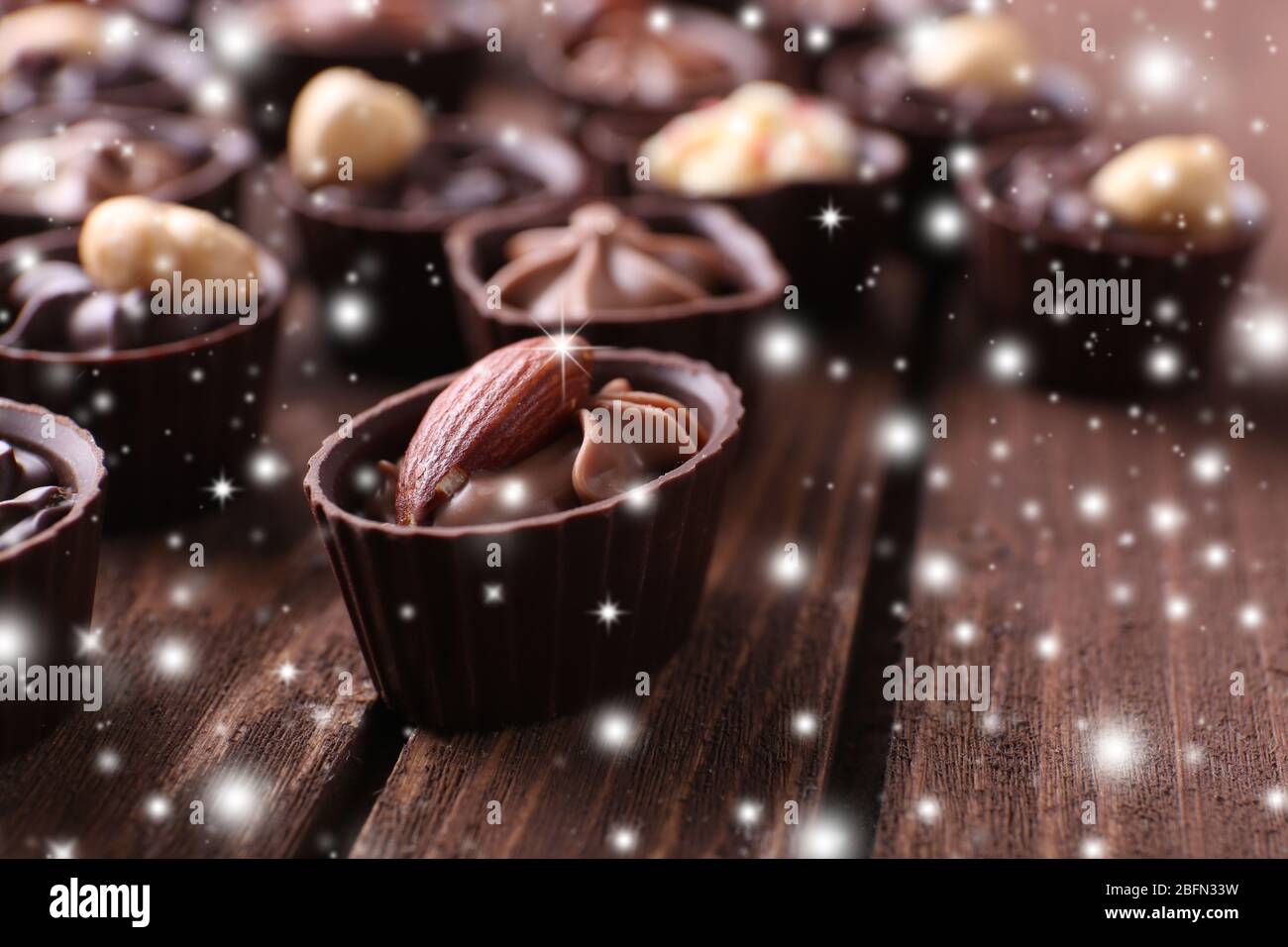 Chocolate sweets with snow effect Stock Photo - Alamy
