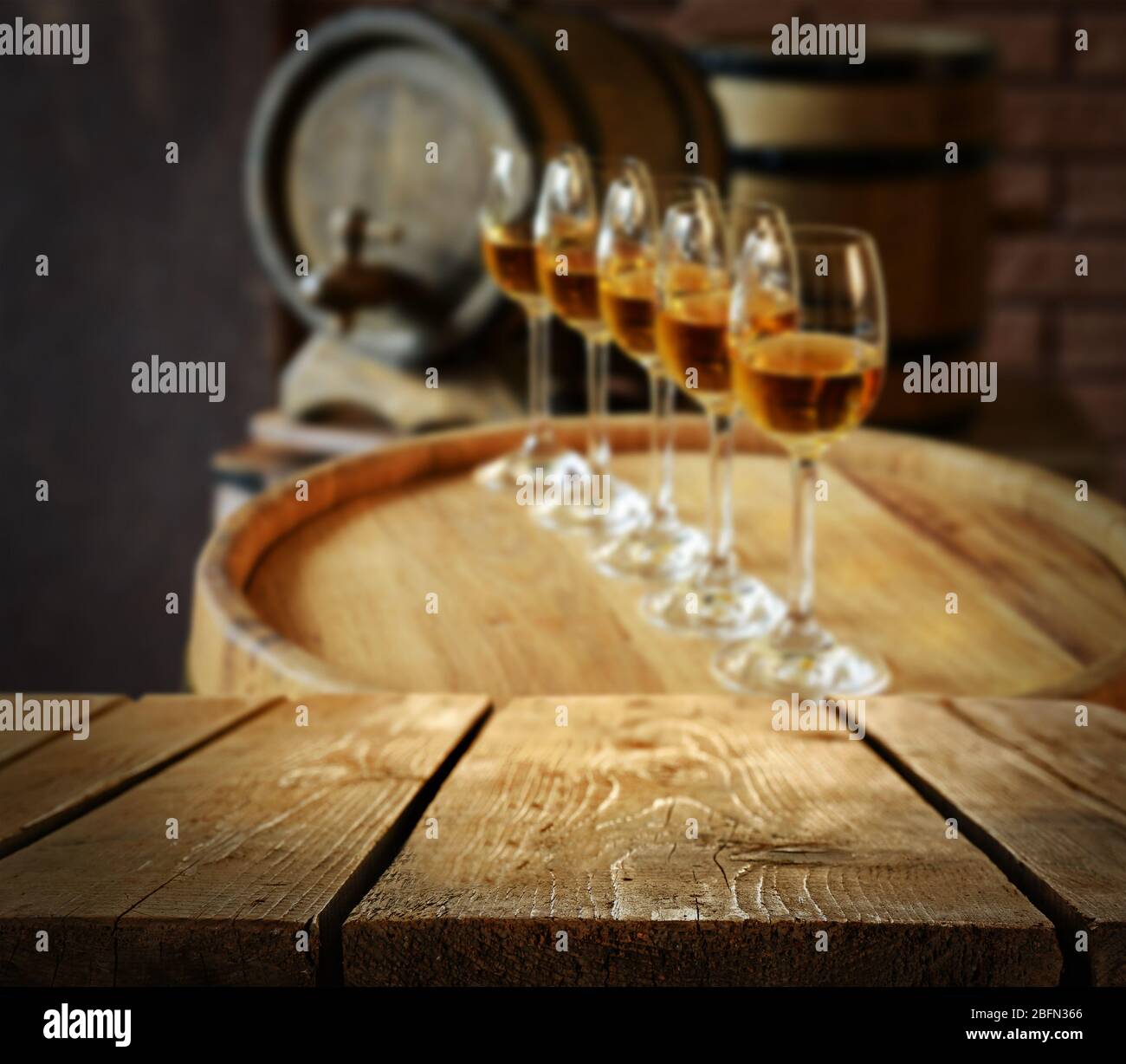 Barrels of wine and empty wooden desk Stock Photo - Alamy