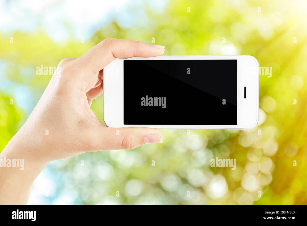 Woman shows smartphone green screen hi-res stock photography and images ...