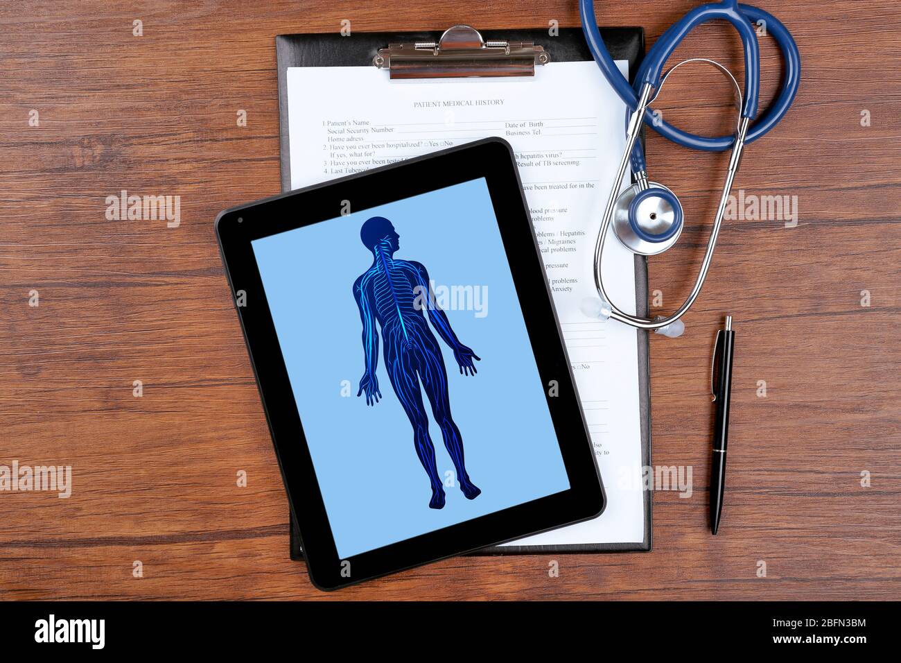 Medical picture on the tablet screen and stethoscope on wooden ...