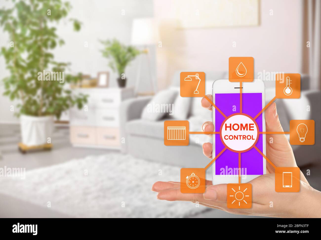 Using smart home app on phone. Smart home control concept Stock Photo ...