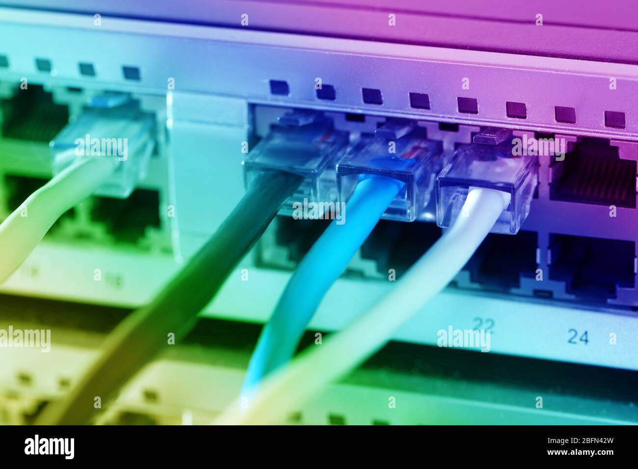 Telecommunication ethernet cables connected to Internet switch. Data center concept Stock Photo ...