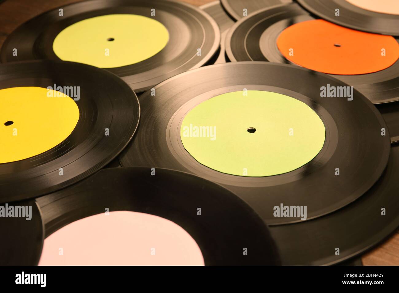 Vinyl records with multicolored labels, background Stock Photo - Alamy