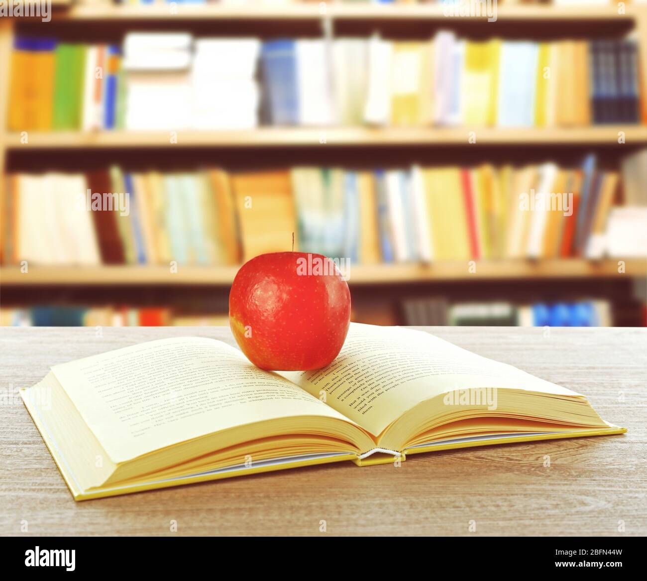Books on desk in library. School concept Stock Photo - Alamy