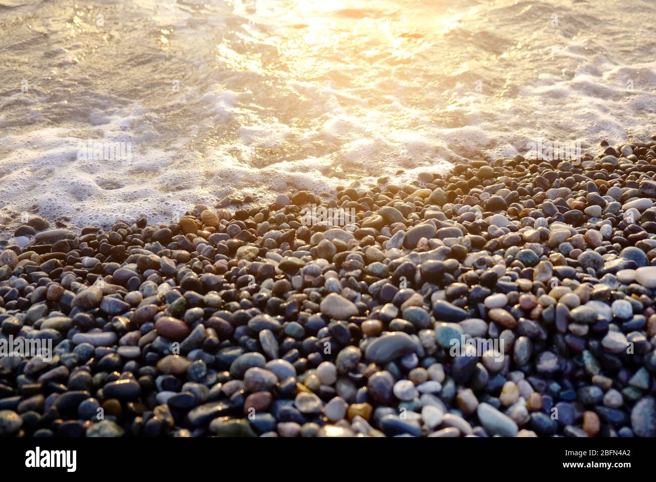 Nature background with pebble on sunset Stock Photo - Alamy
