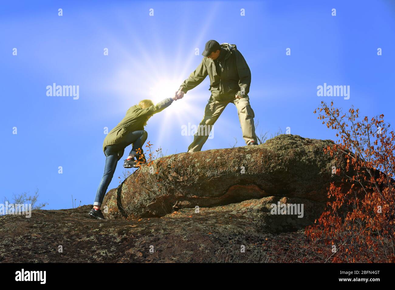 Helping hands mountain climbing hi-res stock photography and images - Alamy