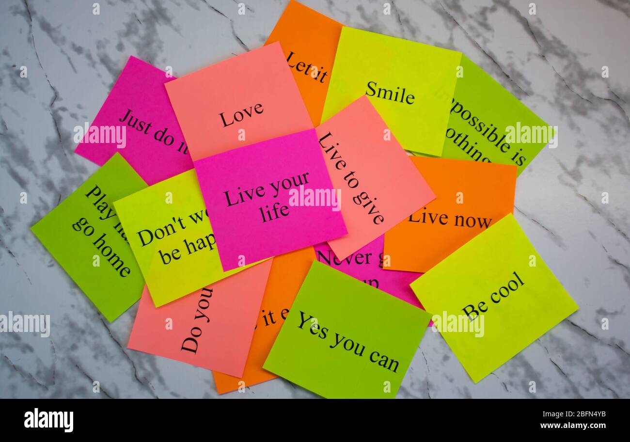 Motivational words on colorful stickers on a marble table. Business ...