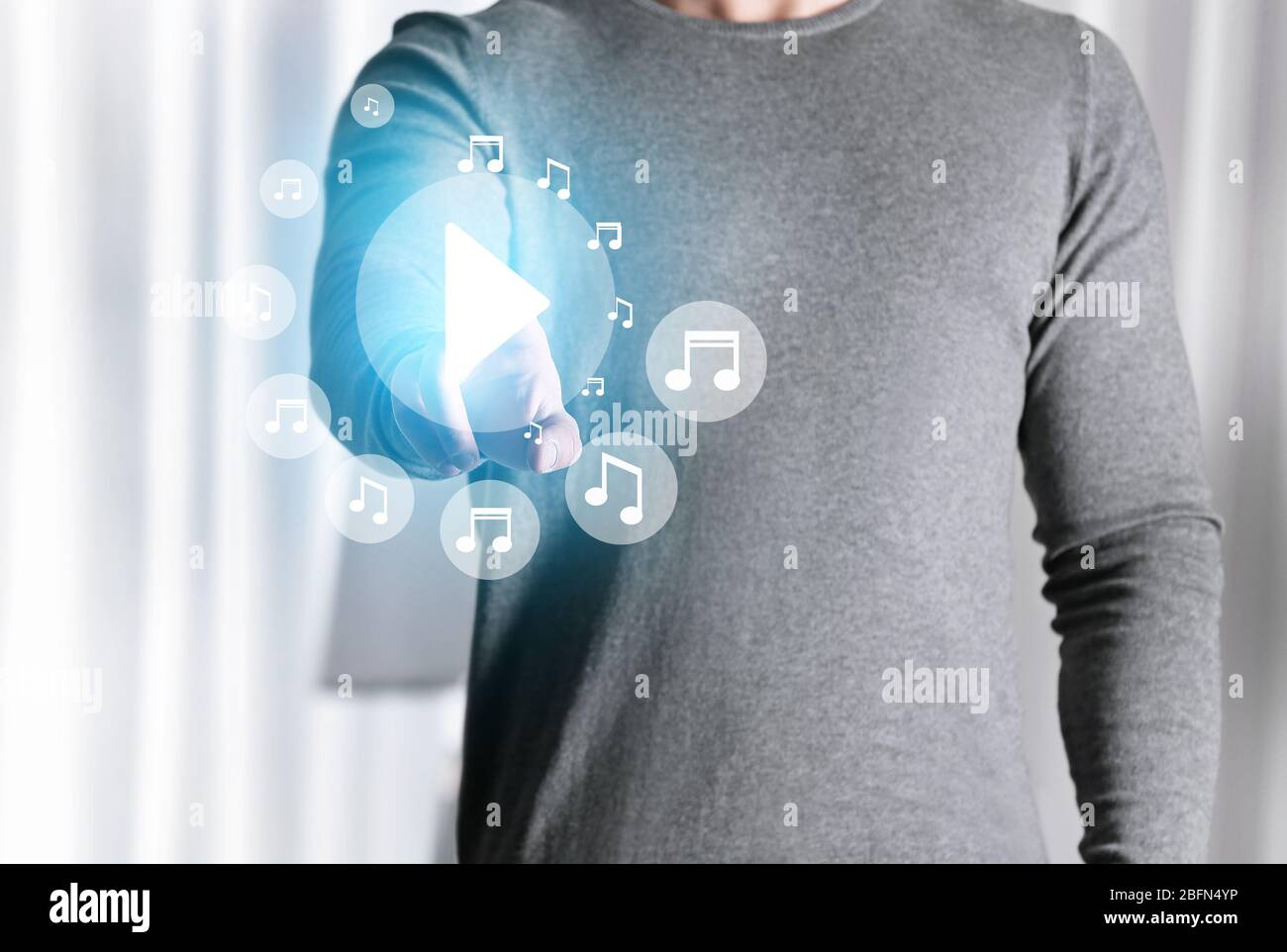 Man push play button on touch screen Stock Photo - Alamy