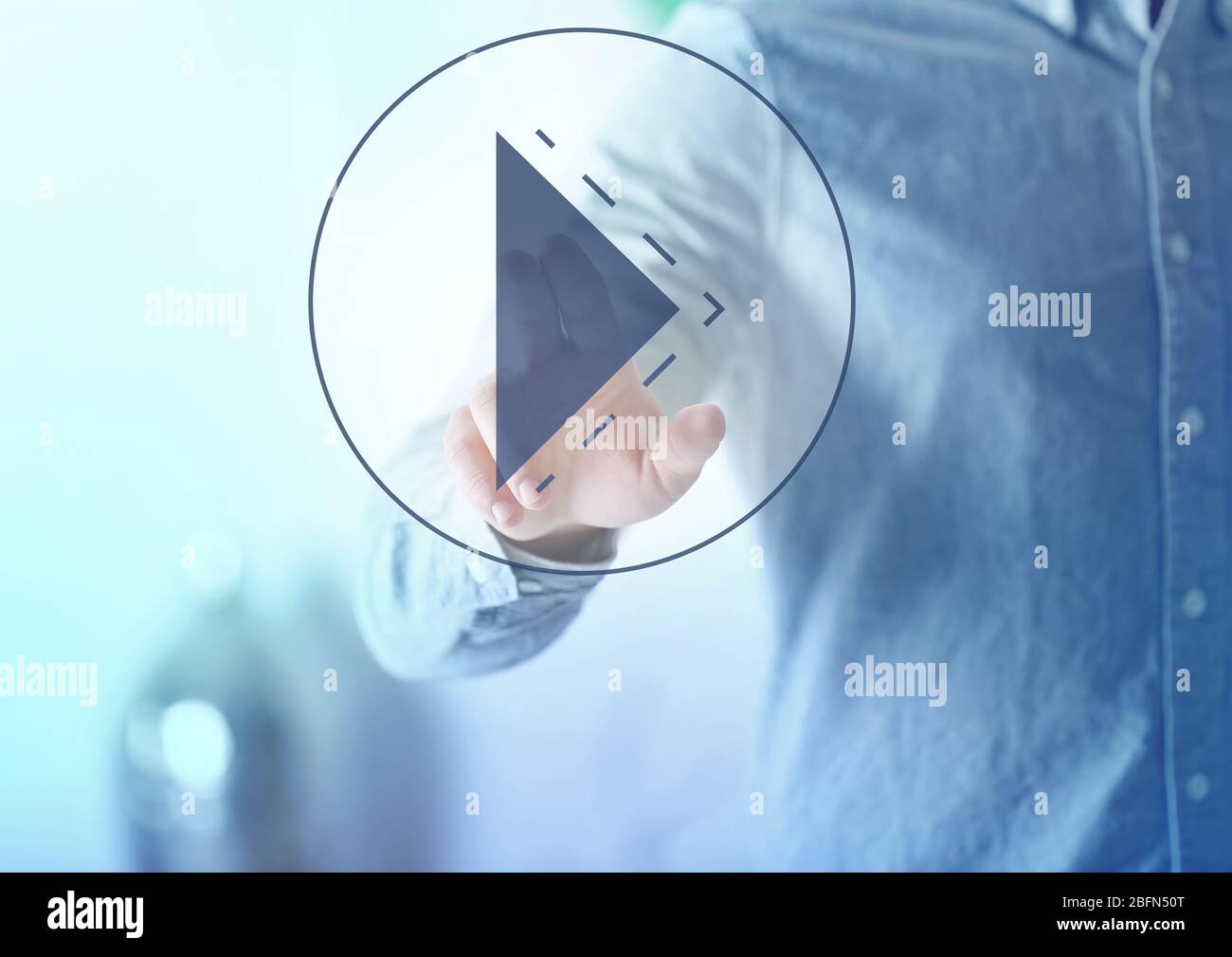 Man push play button on touch screen Stock Photo - Alamy
