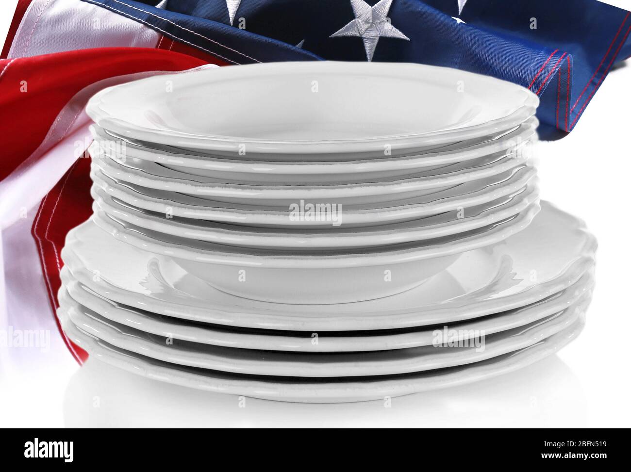 Stack of plates and American flag Stock Photo - Alamy