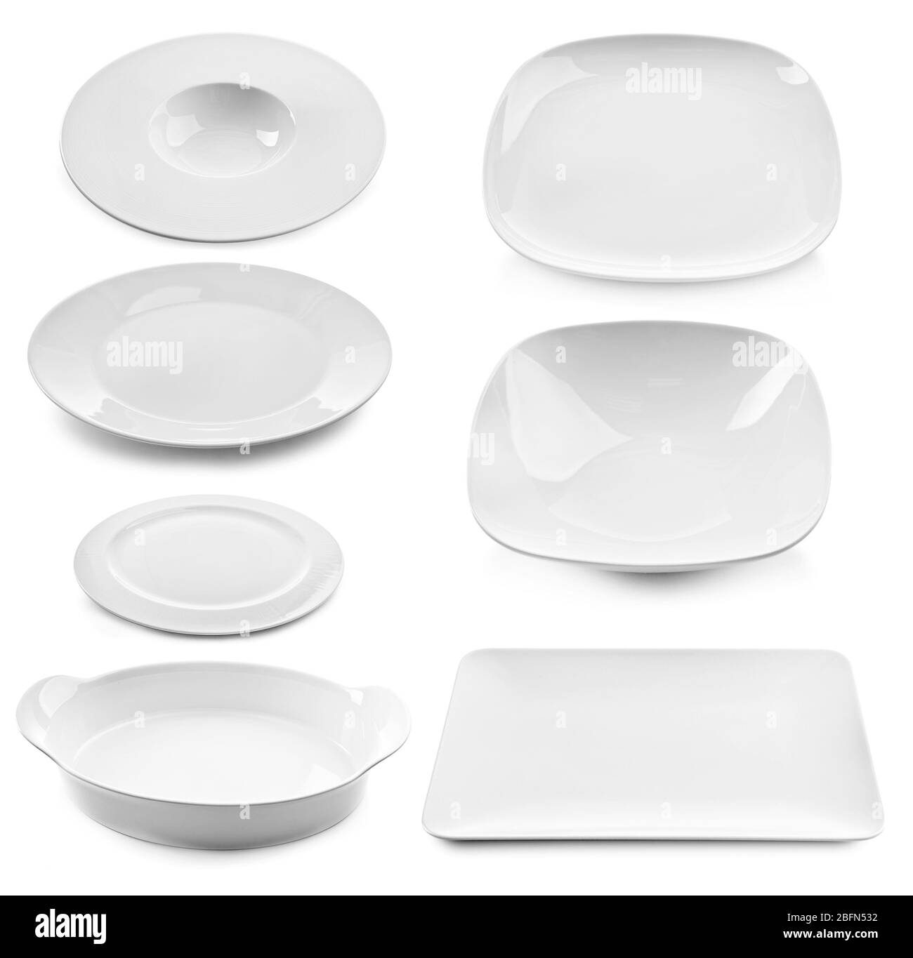 Collage of different plates isolated on white Stock Photo - Alamy