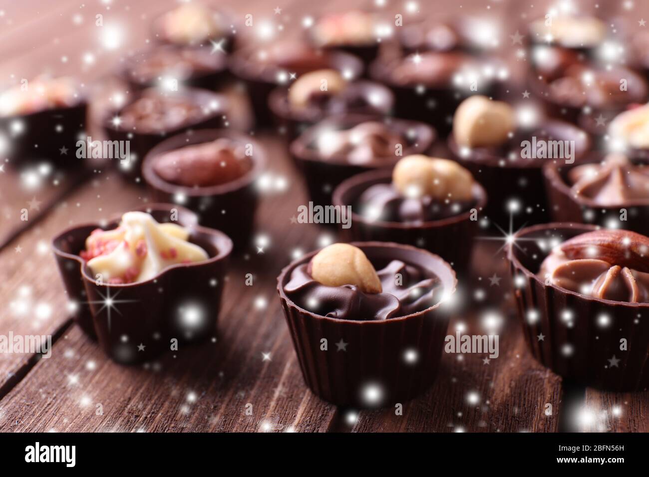 Chocolate sweets with snow effect Stock Photo - Alamy