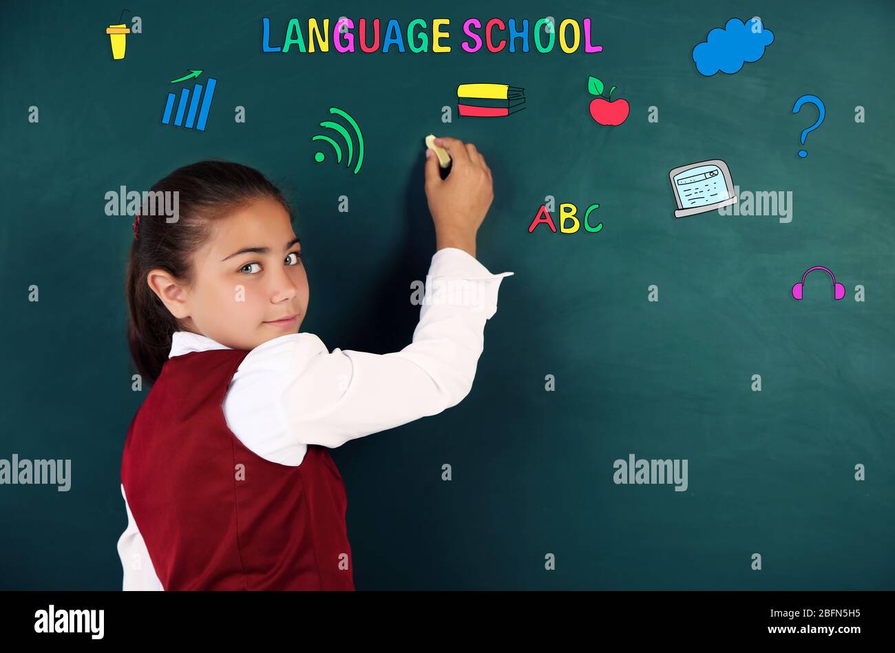 Language school concept with schoolgirl Stock Photo - Alamy