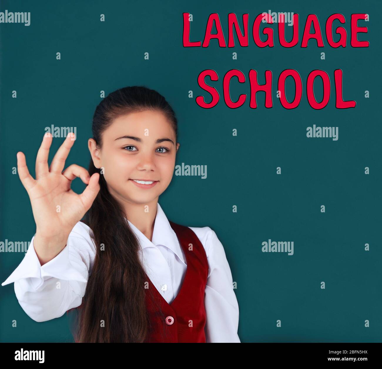 Language school concept with schoolgirl Stock Photo - Alamy