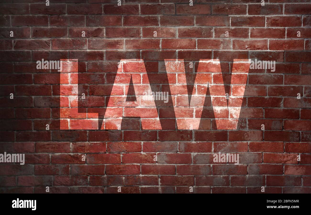 "Law" text on brick wall Stock Photo - Alamy