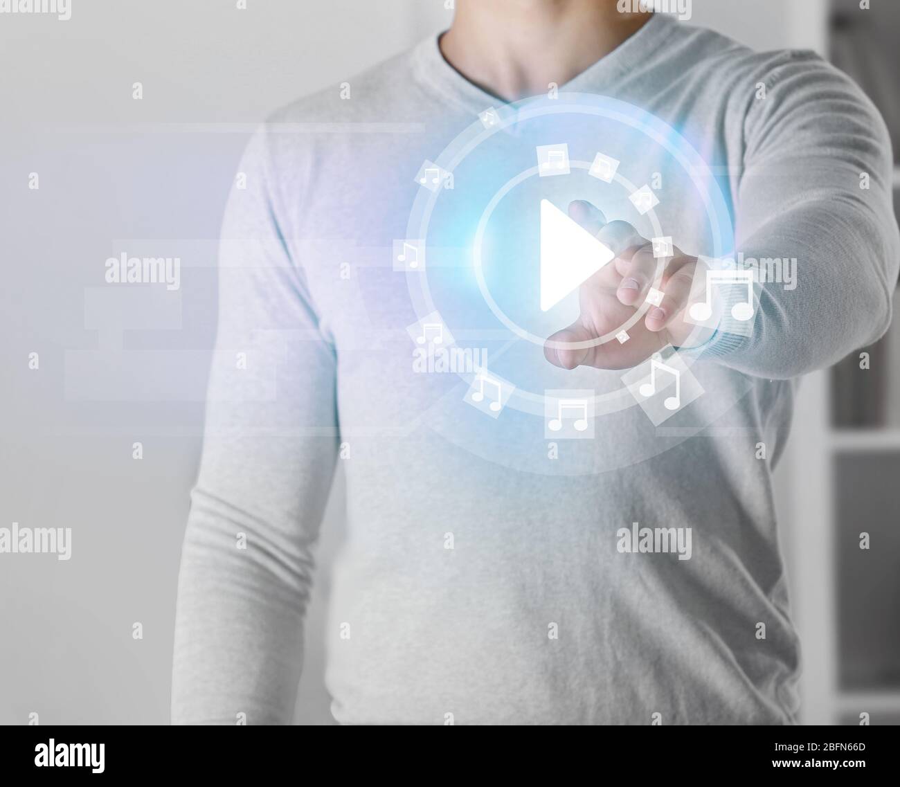 Man push play button on touch screen Stock Photo - Alamy