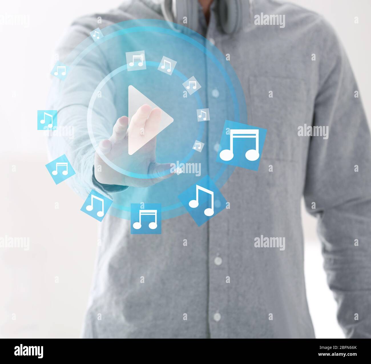 Man push play button on touch screen Stock Photo - Alamy