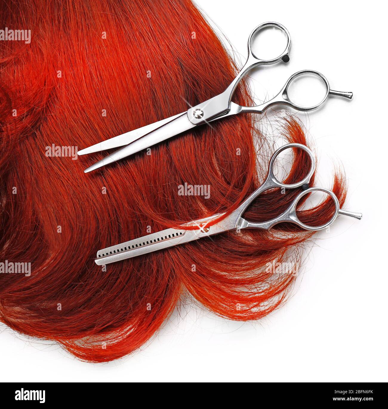Hairdresser's scissors with strand of red hair, isolated on white Stock ...