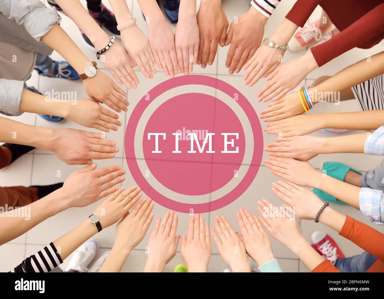 Text Time and group of people hands together Stock Photo - Alamy
