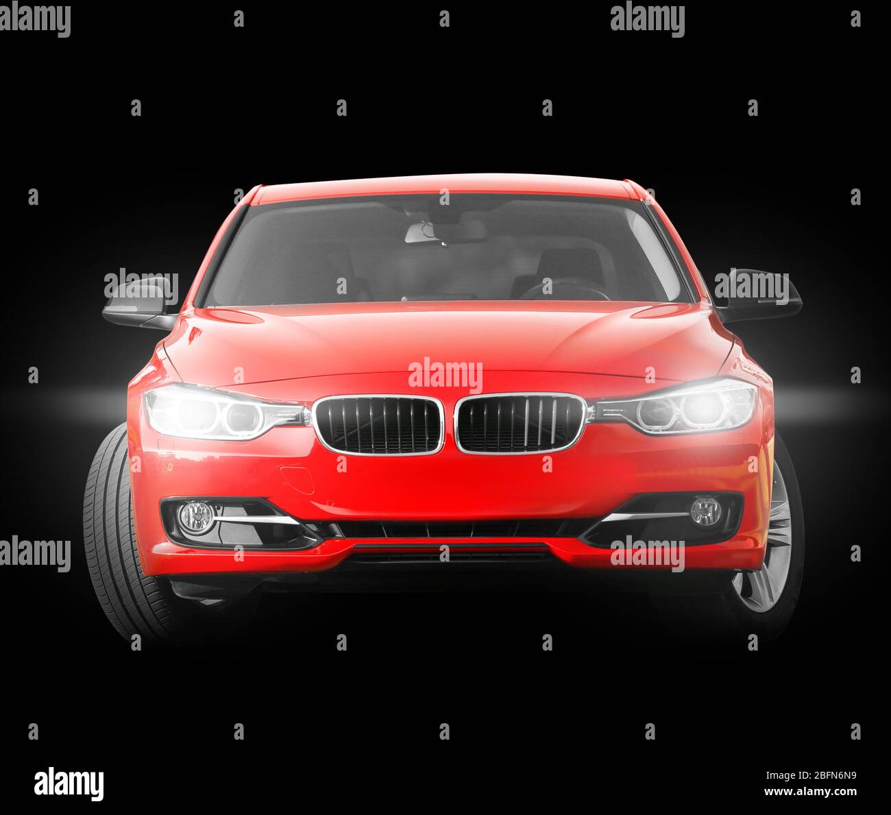 Red car isolated on black Stock Photo - Alamy