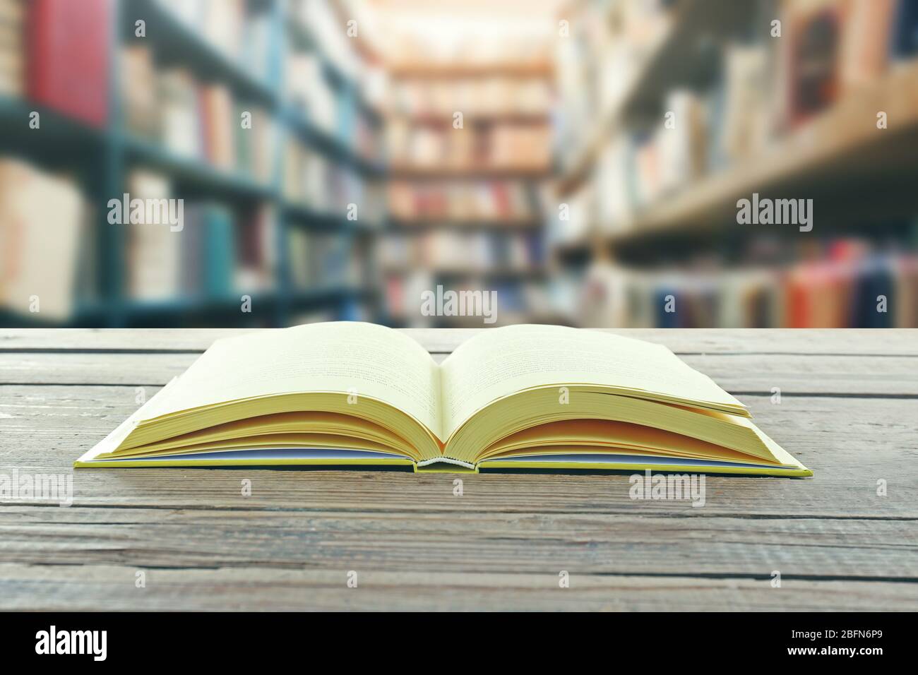 Book on desk in library. School concept Stock Photo - Alamy