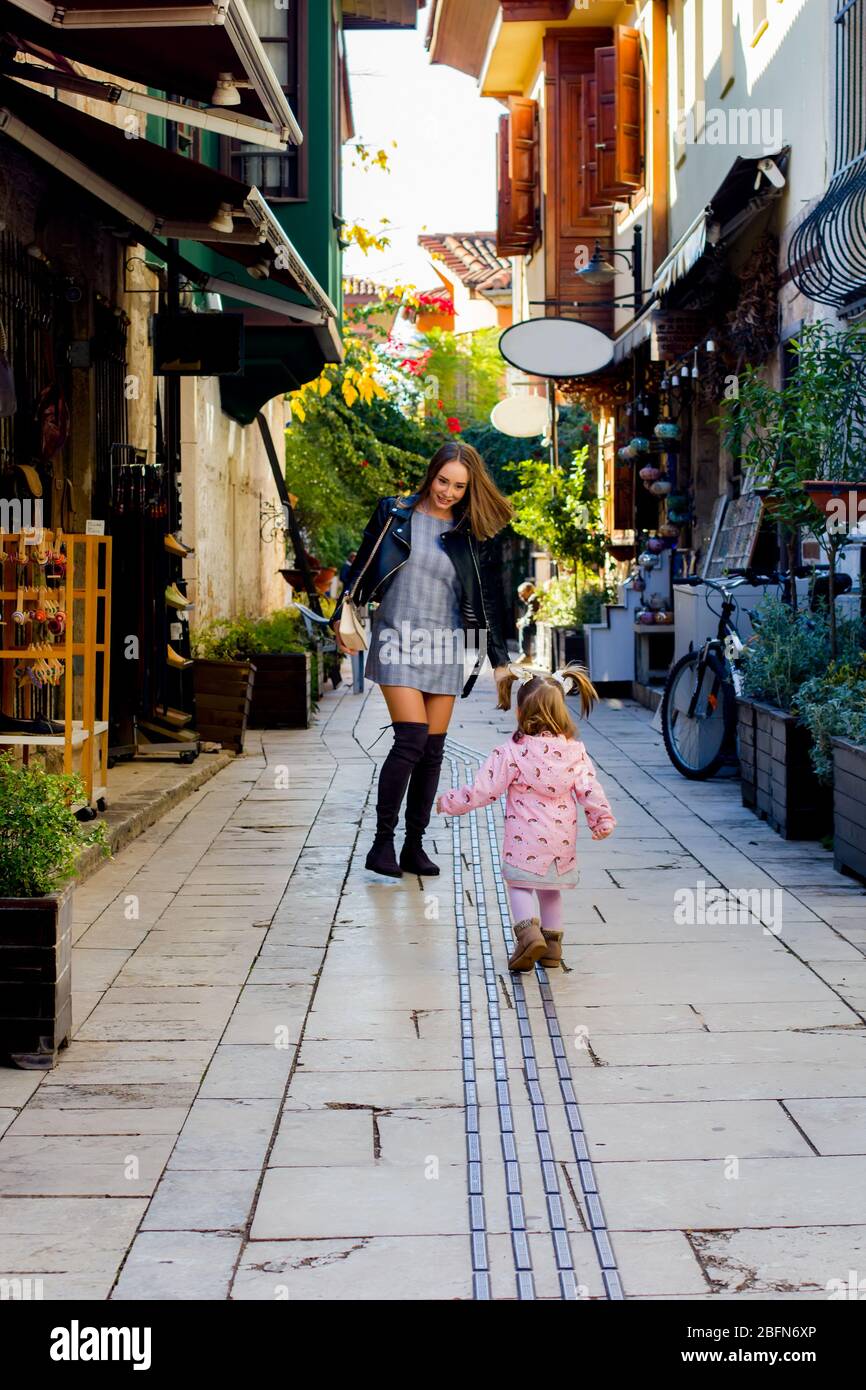 Portrait of an international family, walk through the old town Stock ...