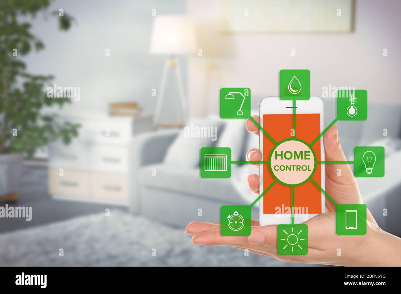 Using smart home app on phone. Smart home control concept Stock Photo ...