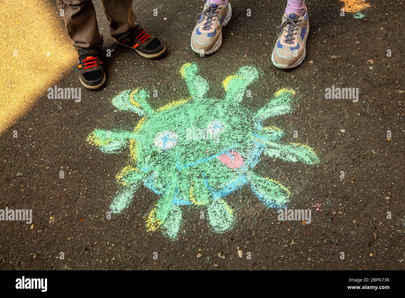 Chalked children's drawing of a virus on asphalt Stock Photo - Alamy