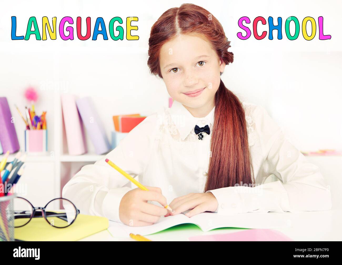 Language school concept with schoolgirl Stock Photo - Alamy