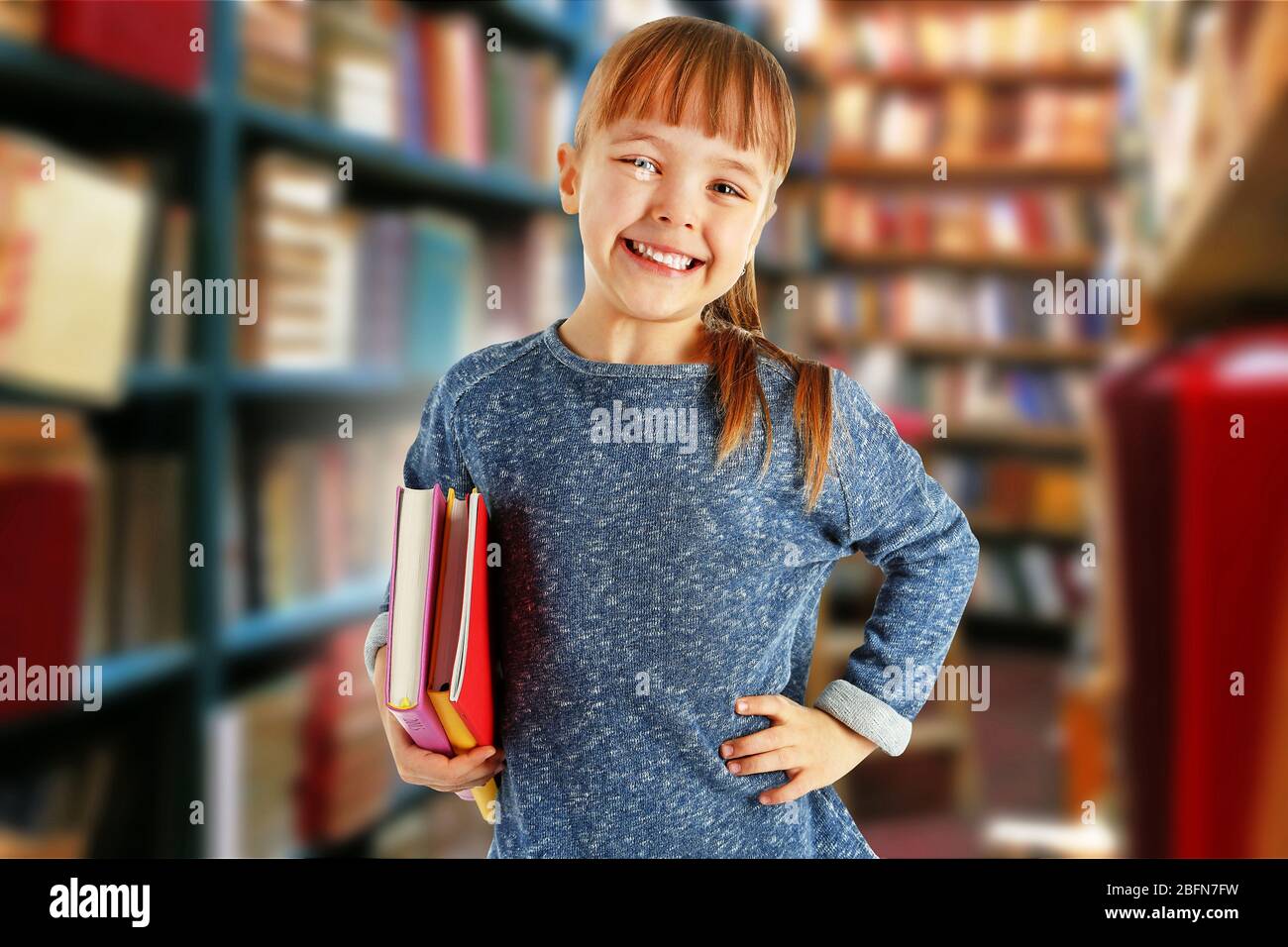 Elementary school girl in bookstore hi-res stock photography and images ...