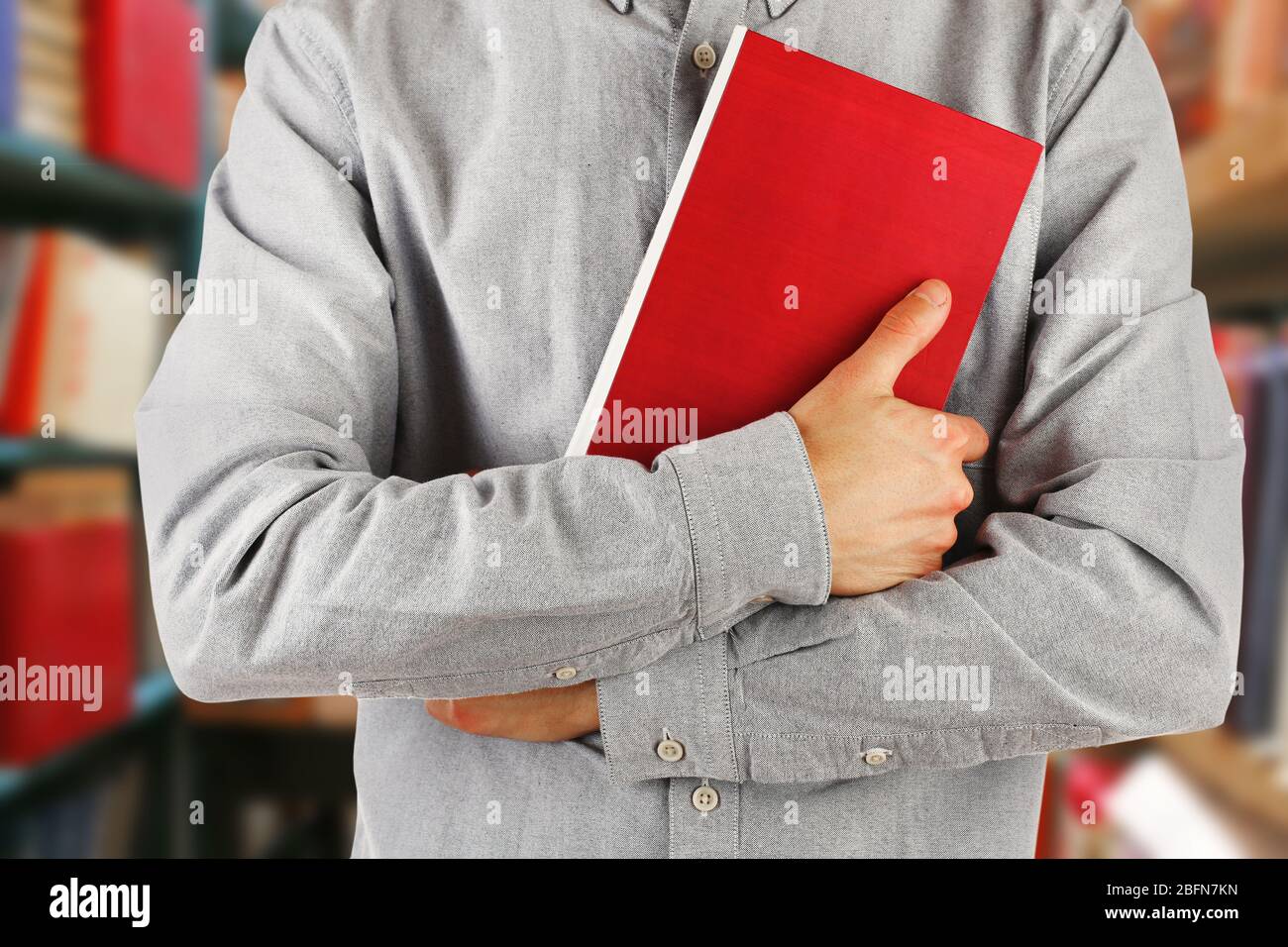 Male hands with book, closeup. School library concept Stock Photo - Alamy