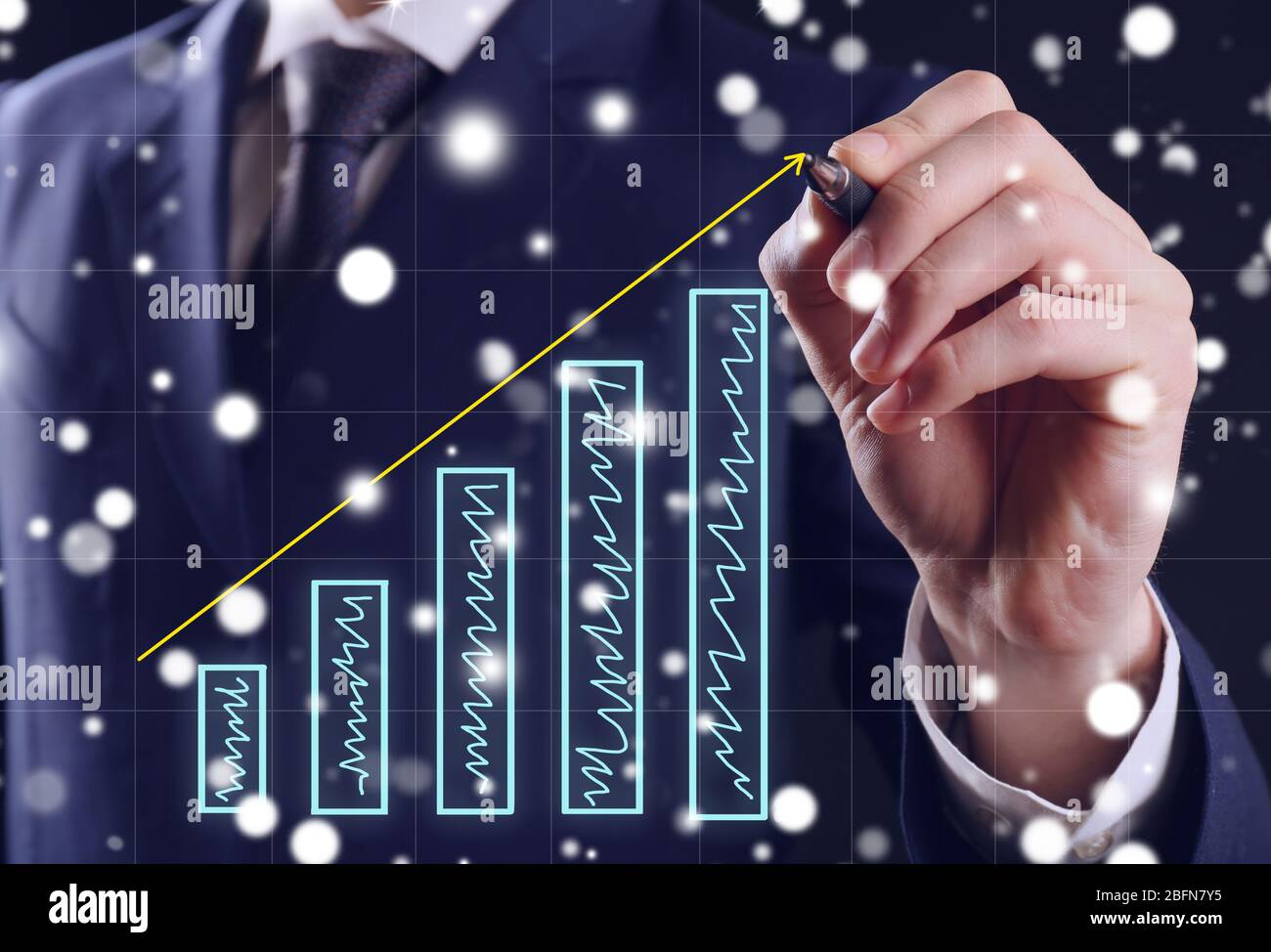 Businessman drawing graph on virtual screen, closeup. Snowy effect ...