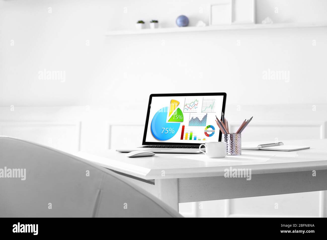 Modern workplace at office. Business presentation on laptop screen ...