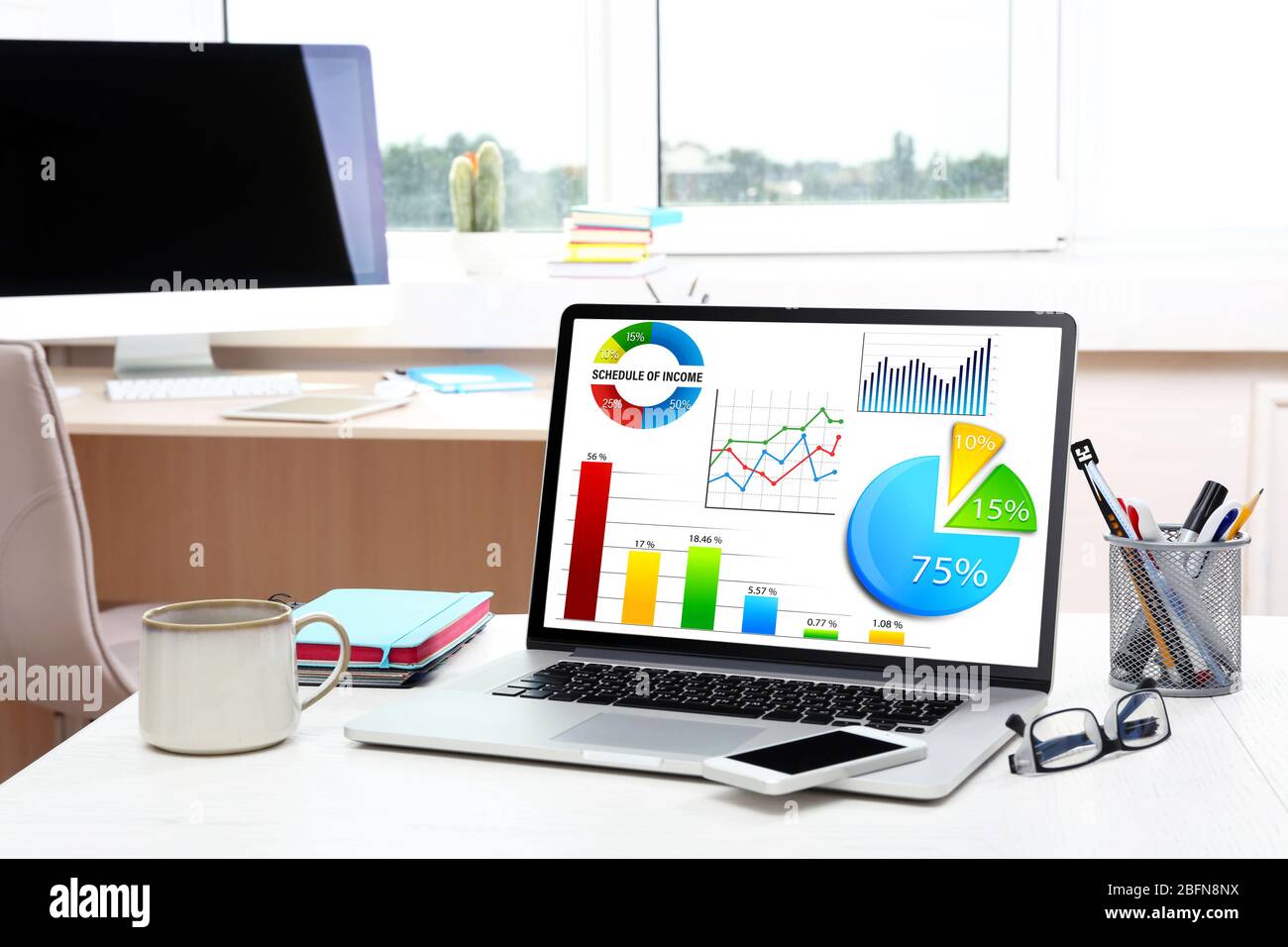 Modern workplace at office. Business presentation on laptop screen ...