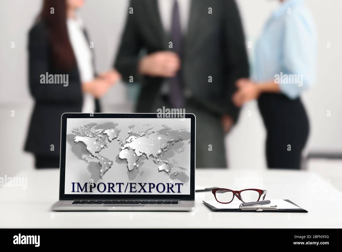 Text IMPORT/EXPORT and world map on laptop screen. Business concept ...
