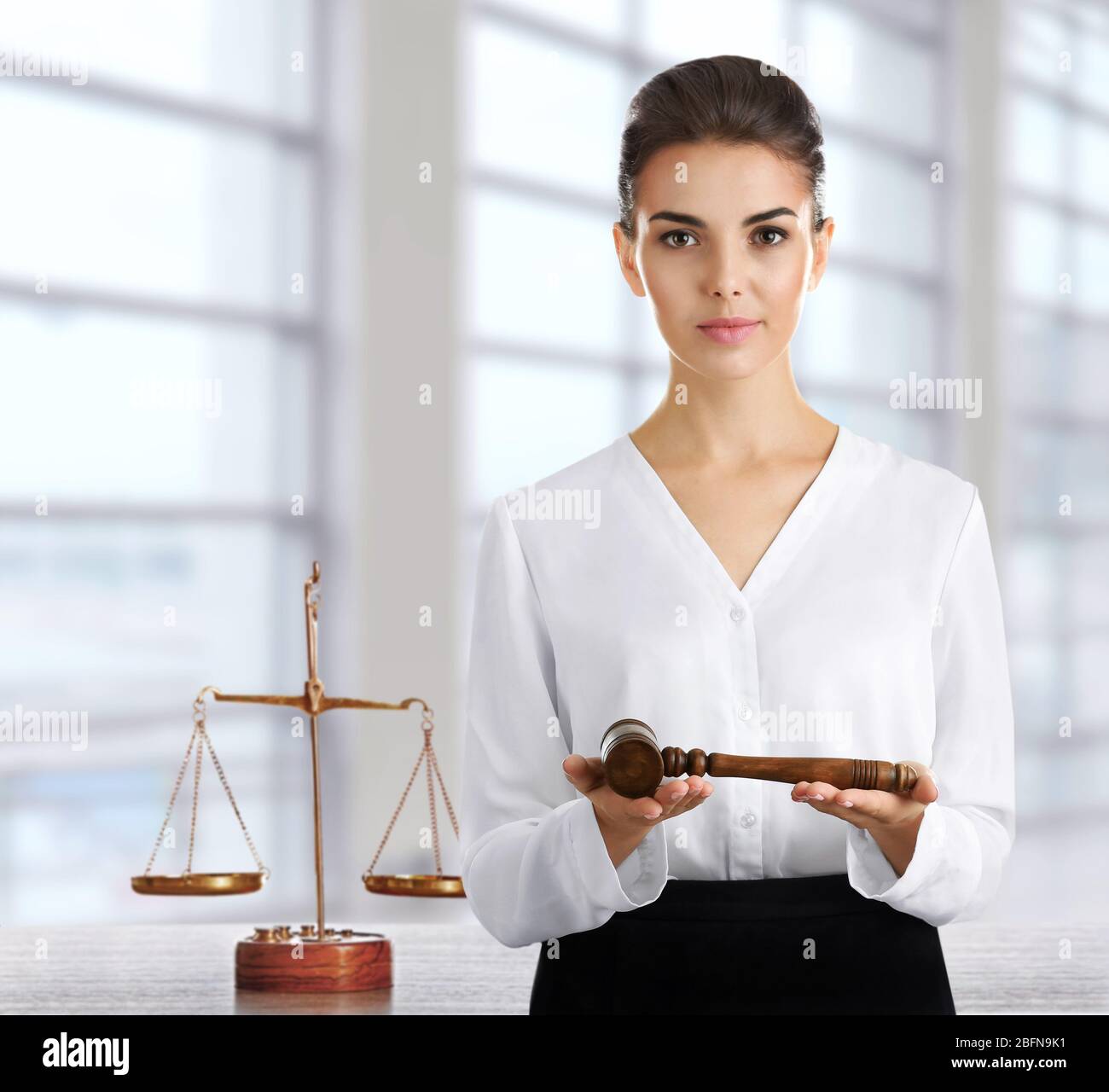 Woman with judge gavel at office. Law and justice concept Stock Photo ...