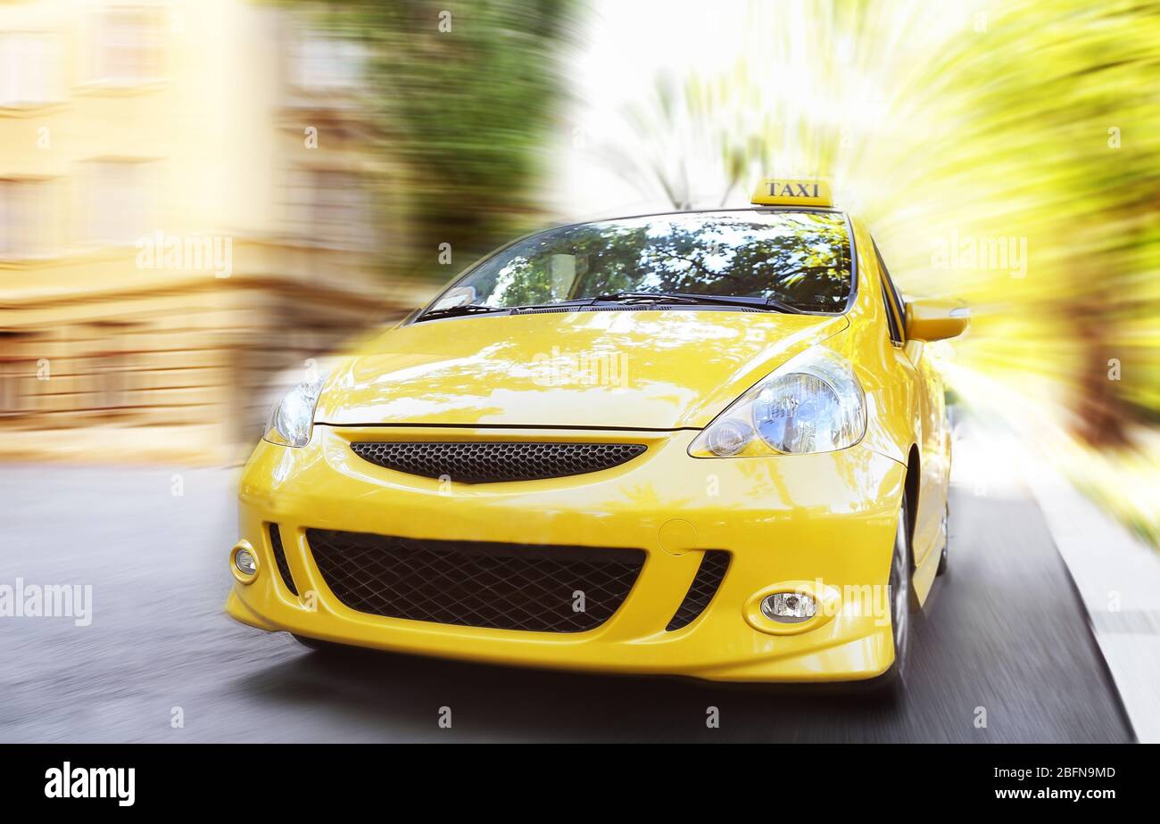 Taxi car driving fast on road, motion effect Stock Photo - Alamy