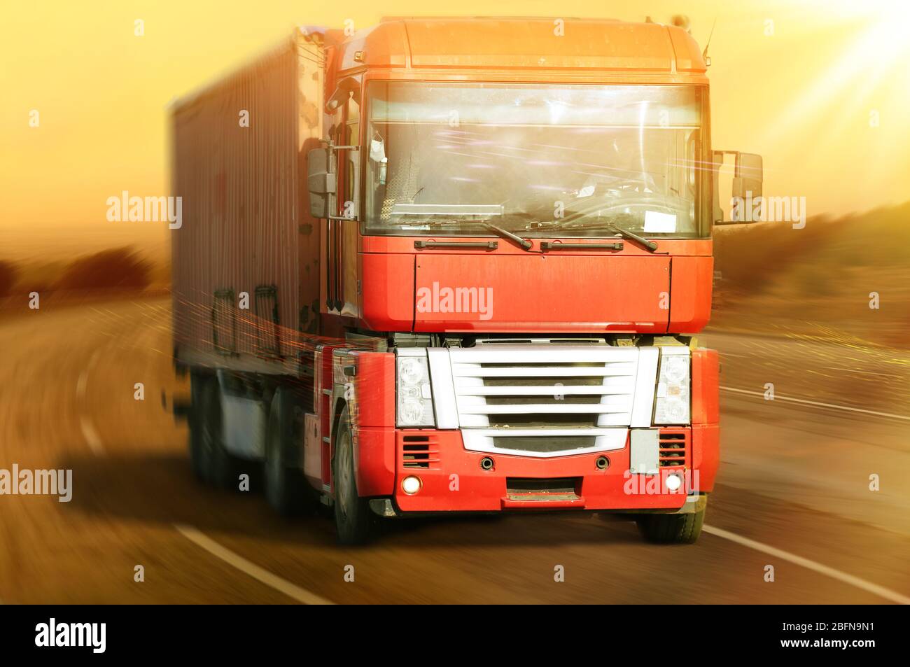 Truck driving fast on road, motion effect Stock Photo - Alamy
