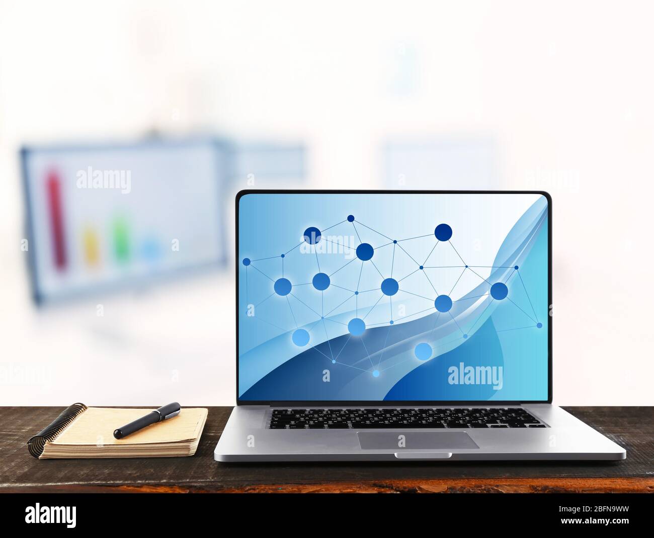 Modern workplace with laptop. Network design on screen Stock Photo - Alamy