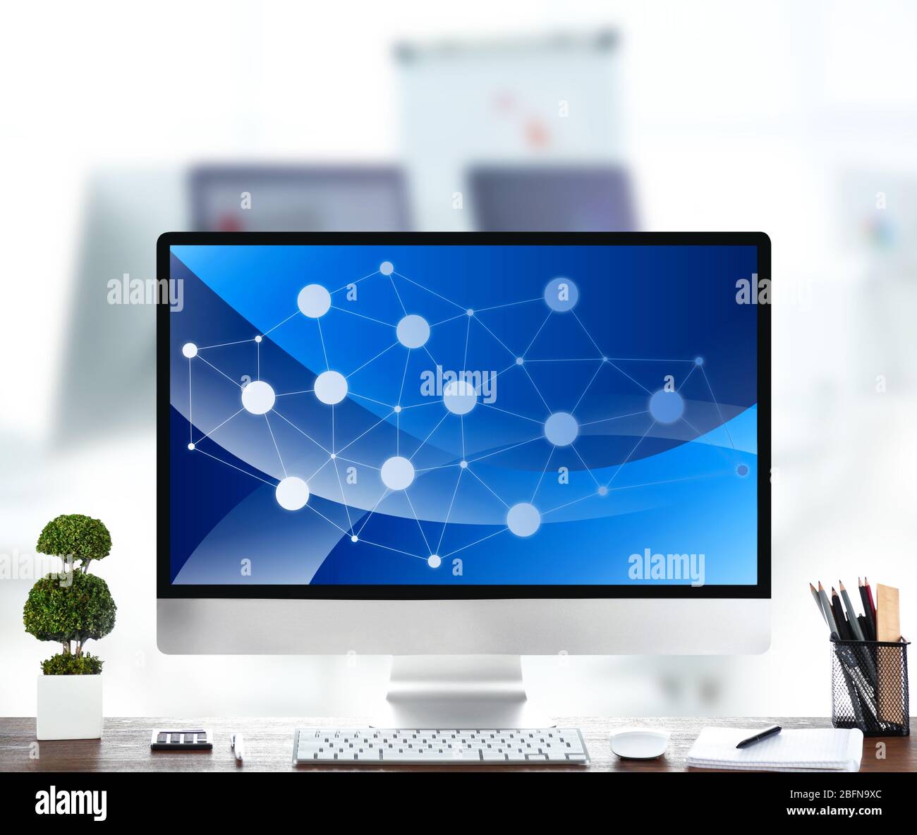 Modern workplace with computer. Network design on screen Stock Photo ...