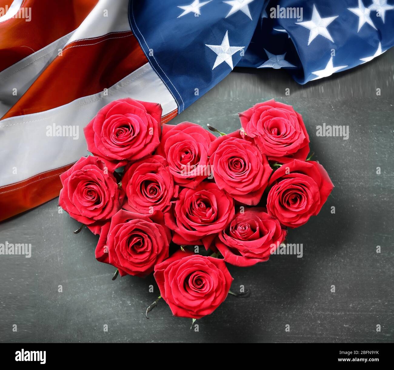 Heart shape of roses and USA flag on gray background. Symbol of America ...