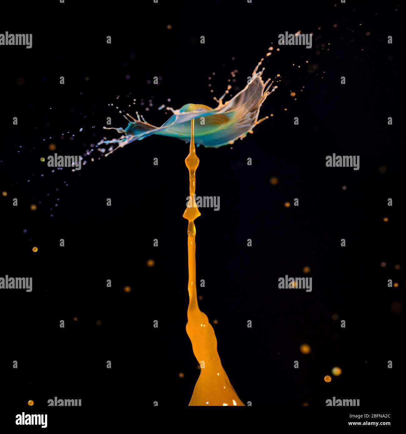Hi speed macro photography of water with bright colors dripping and ...