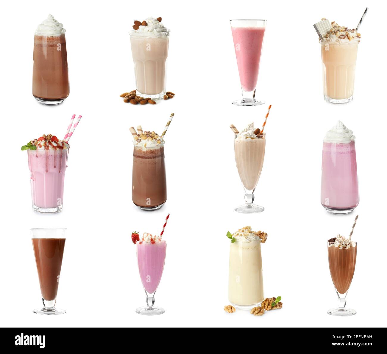Glasses with delicious milk shakes on white background Stock Photo - Alamy