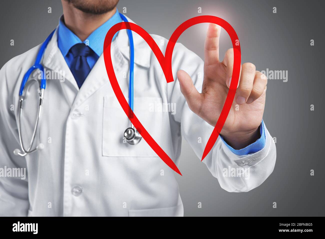 Cardiologist drawing heart, closeup. Cardiology concept Stock Photo - Alamy