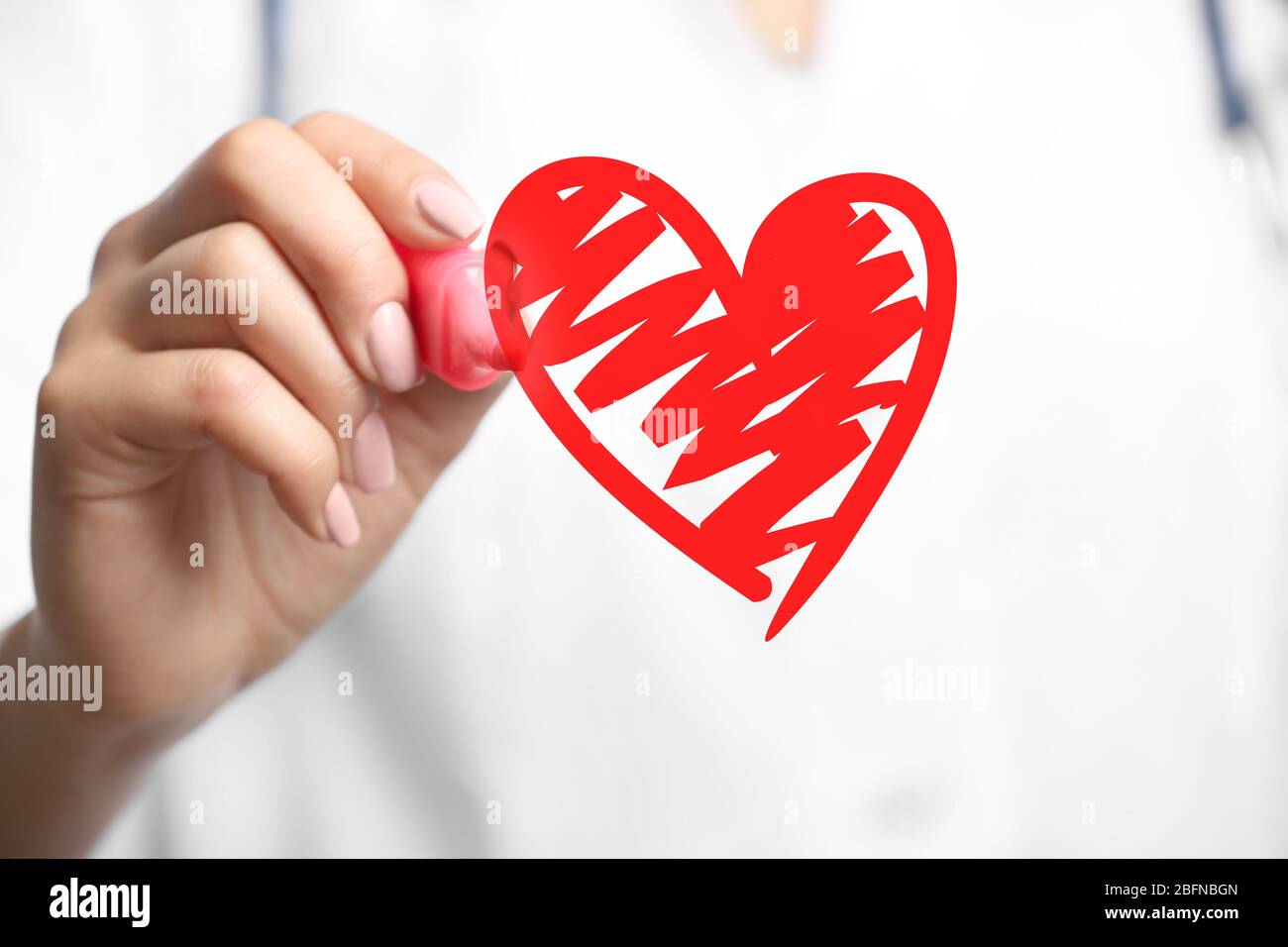 Cardiologist drawing heart, closeup. Cardiology concept Stock Photo - Alamy