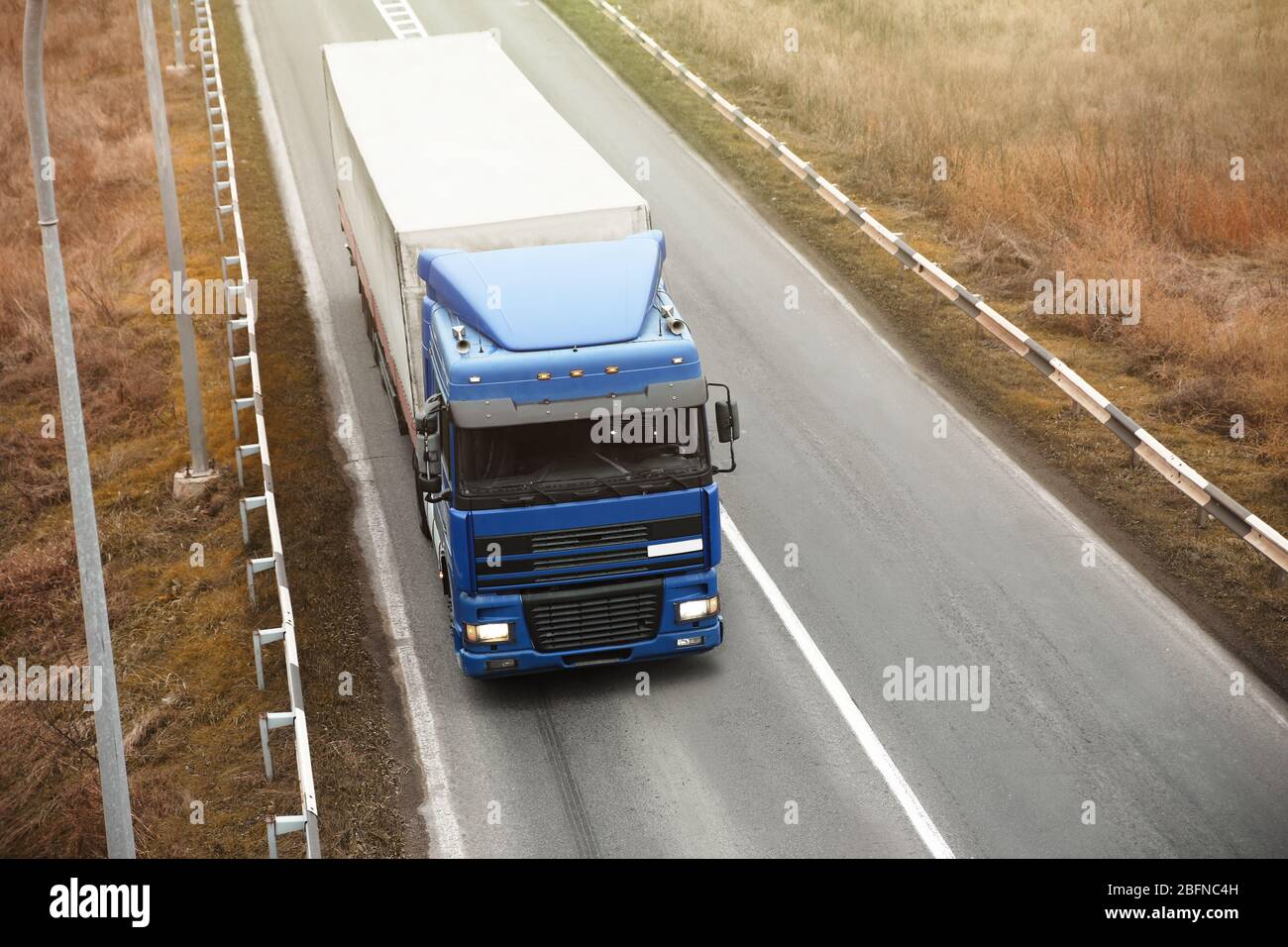 Truck on road. Delivery and shipping concept Stock Photo - Alamy