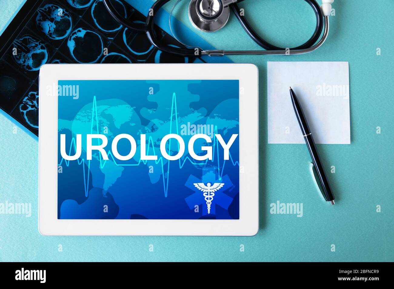 Tablet on color background. Word UROLOGY on screen. Health care concept ...