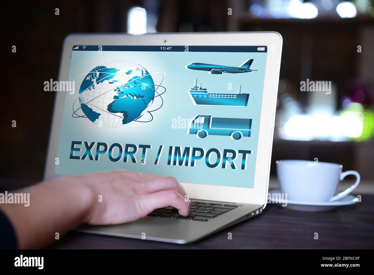 Logistics concept. Woman with laptop. Text EXPORT/IMPORT on screen ...