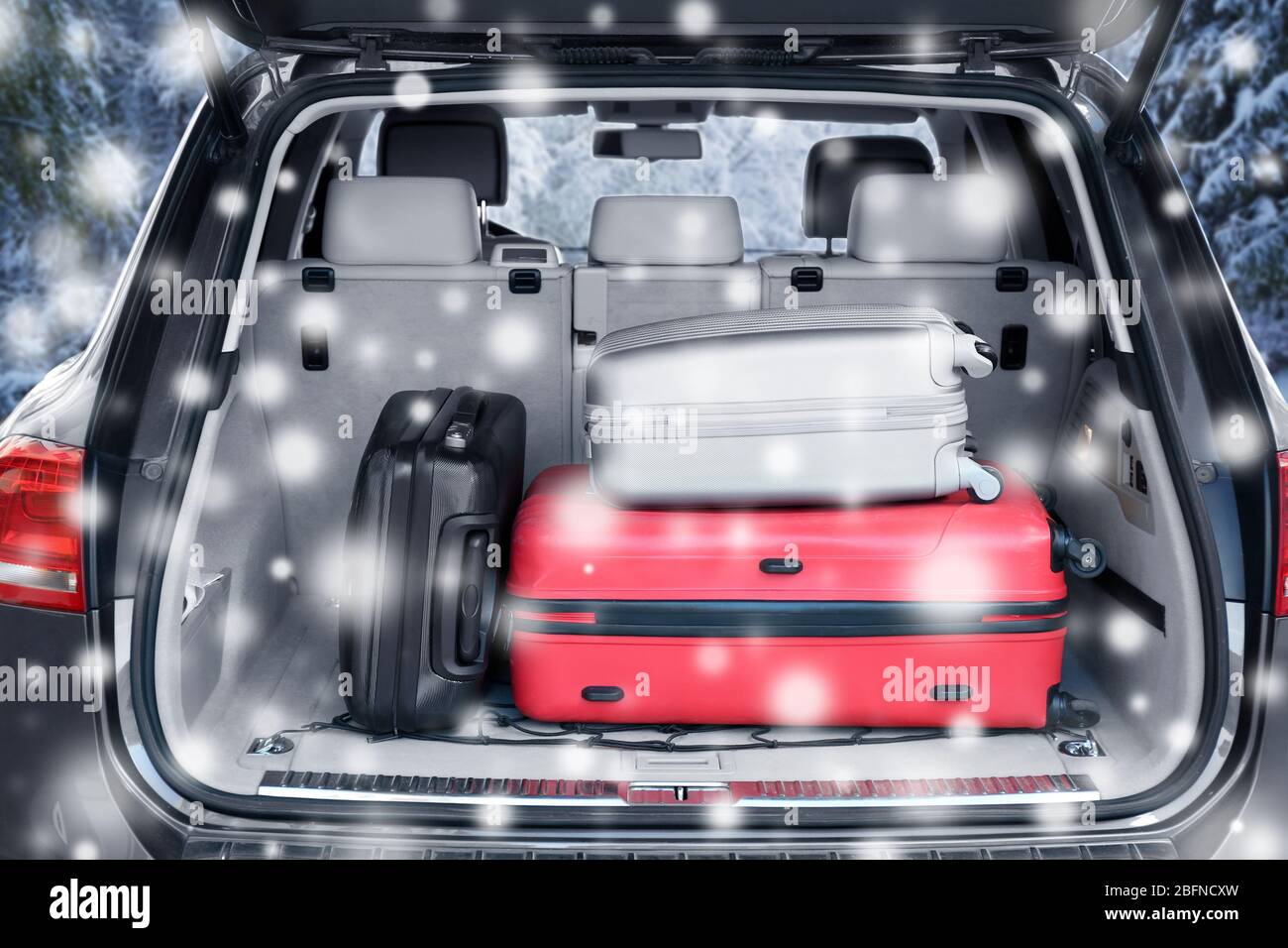 Winter vacation concept. Snowy effect on background. Car trunk loaded ...