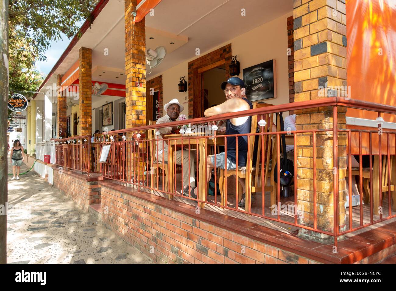 Man sitting outside a bar hi-res stock photography and images - Alamy